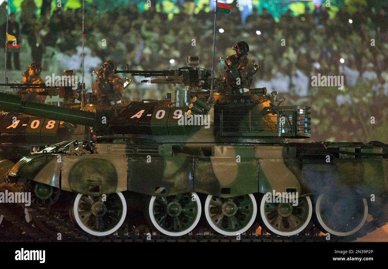 Military tanks are driven in a parade during a ceremony to mark Myanmar ...