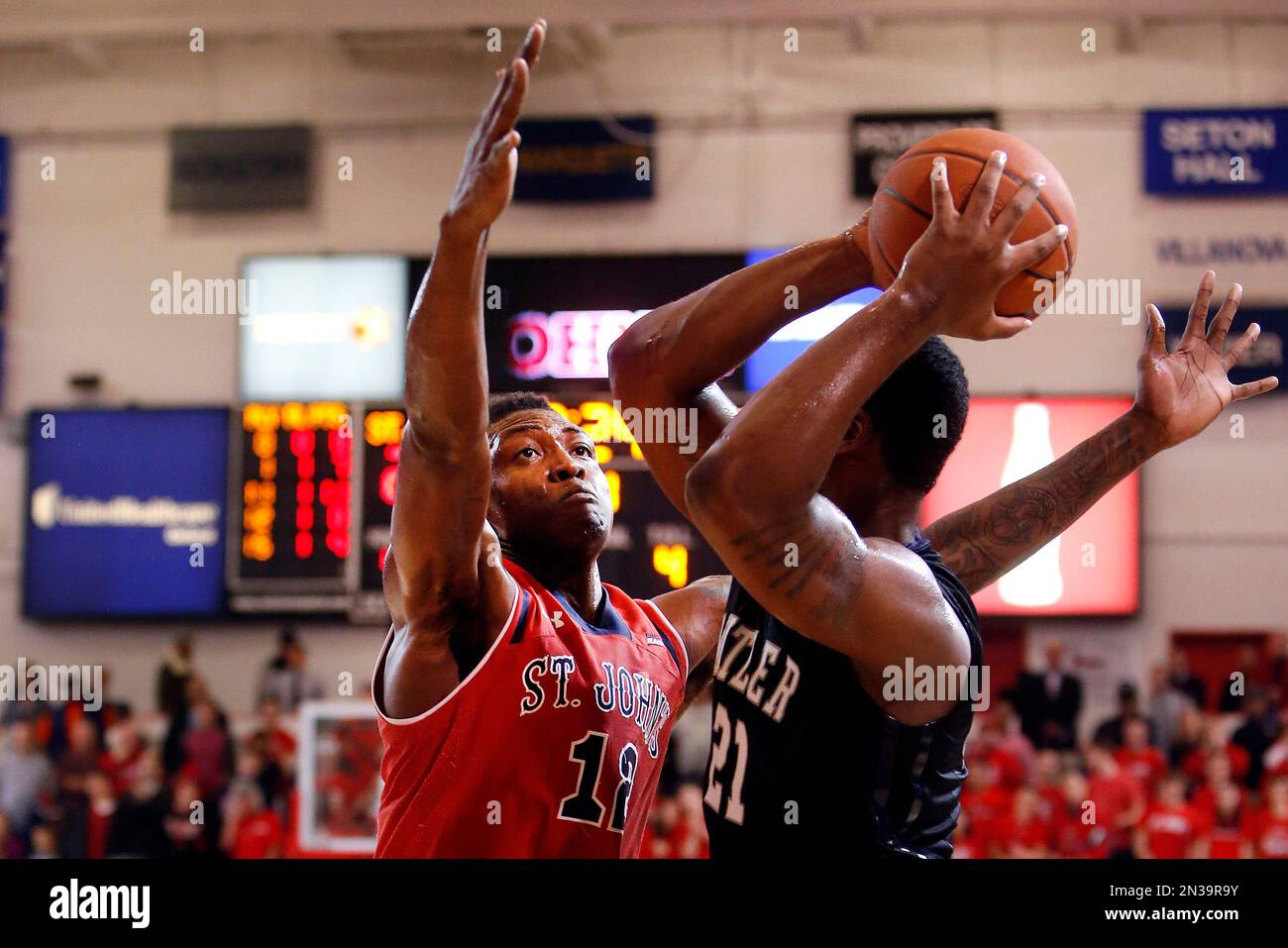 St. John's Chris Obekpa (12), of Nigeria, guards Butler's Roosevelt ...