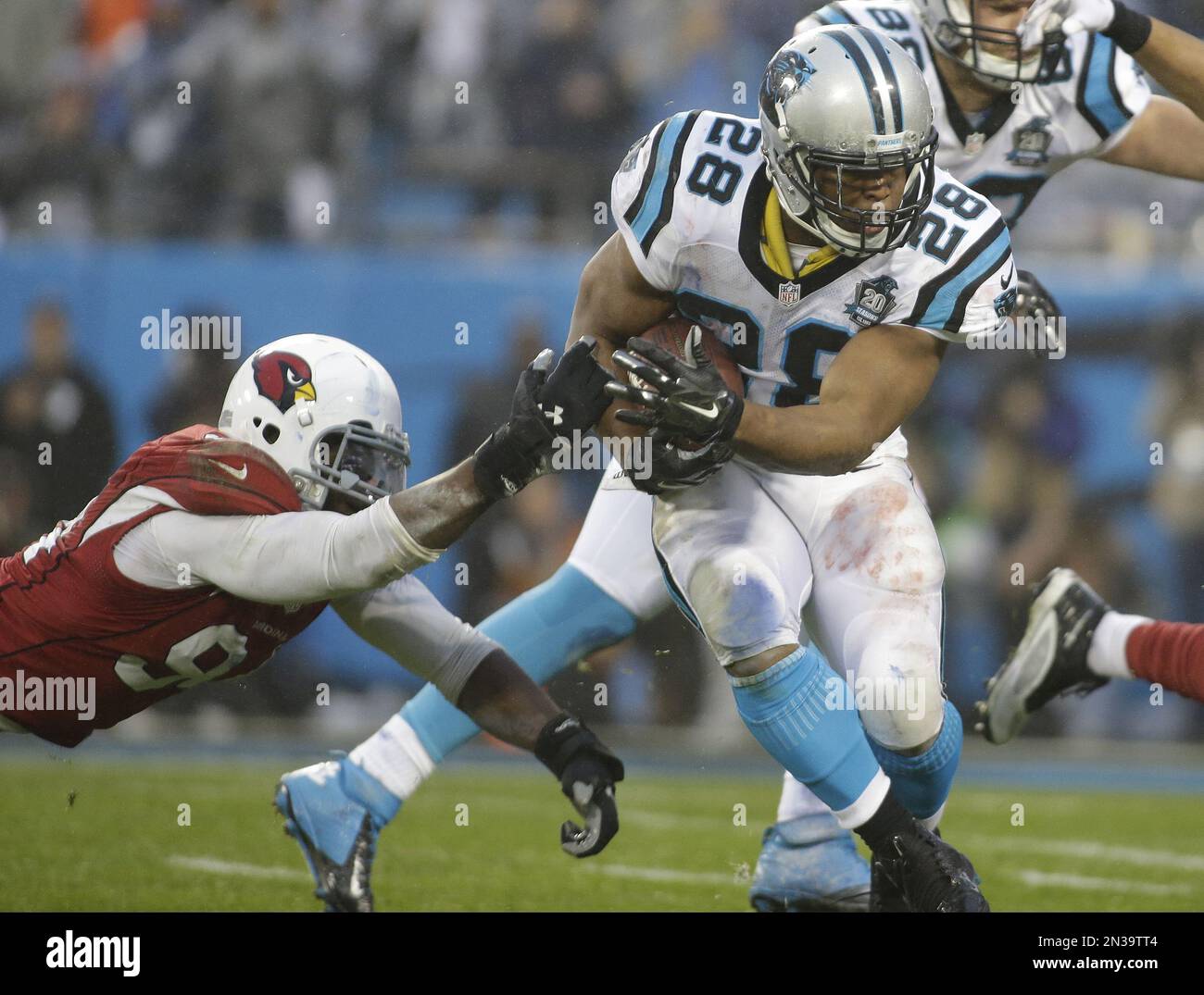 Arizona Cardinals' Sam Acho (94) tries to tackle Carolina Panthers ...