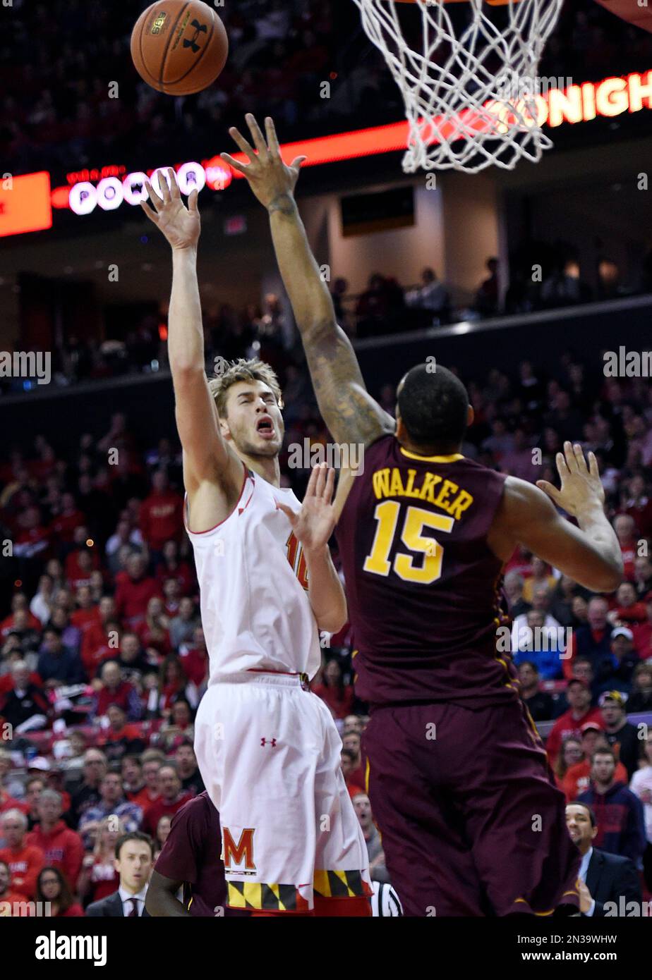 Maryland forward Jake Layman, left, shoots over Minnesota forward ...