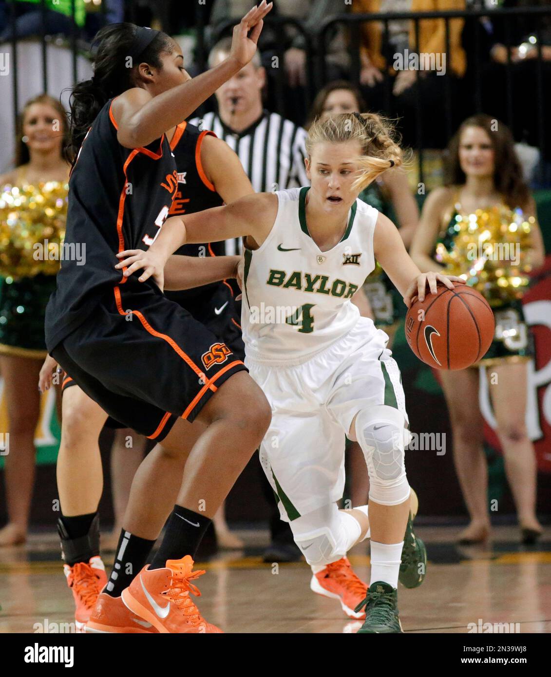 Baylor guard Kristy Wallace (4) dribbles against Oklahoma State center ...