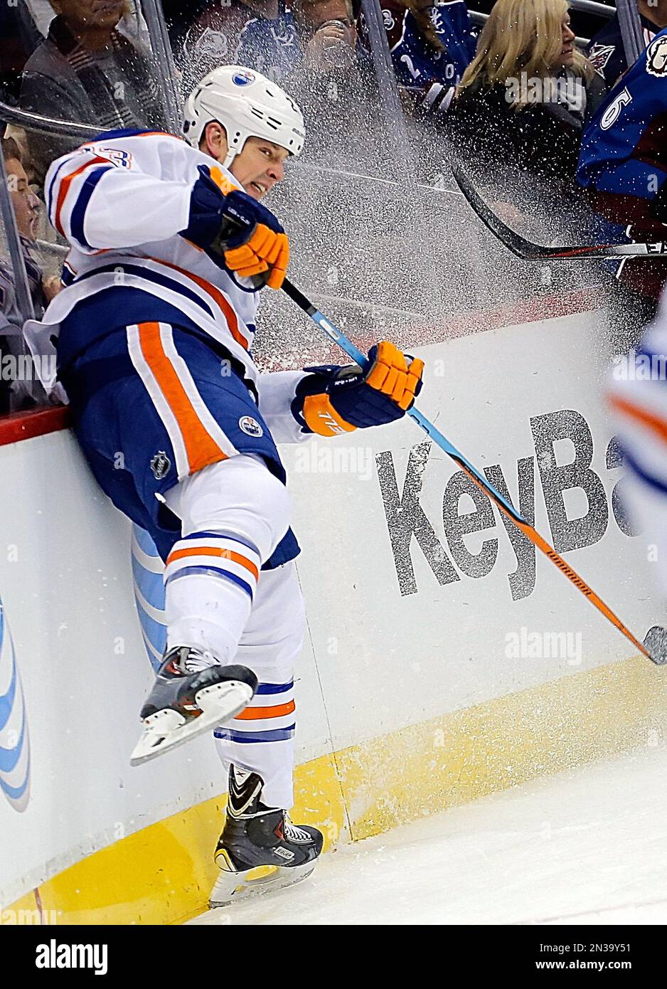 Edmonton Oilers center Matt Hendricks (23) crashes into the boards ...