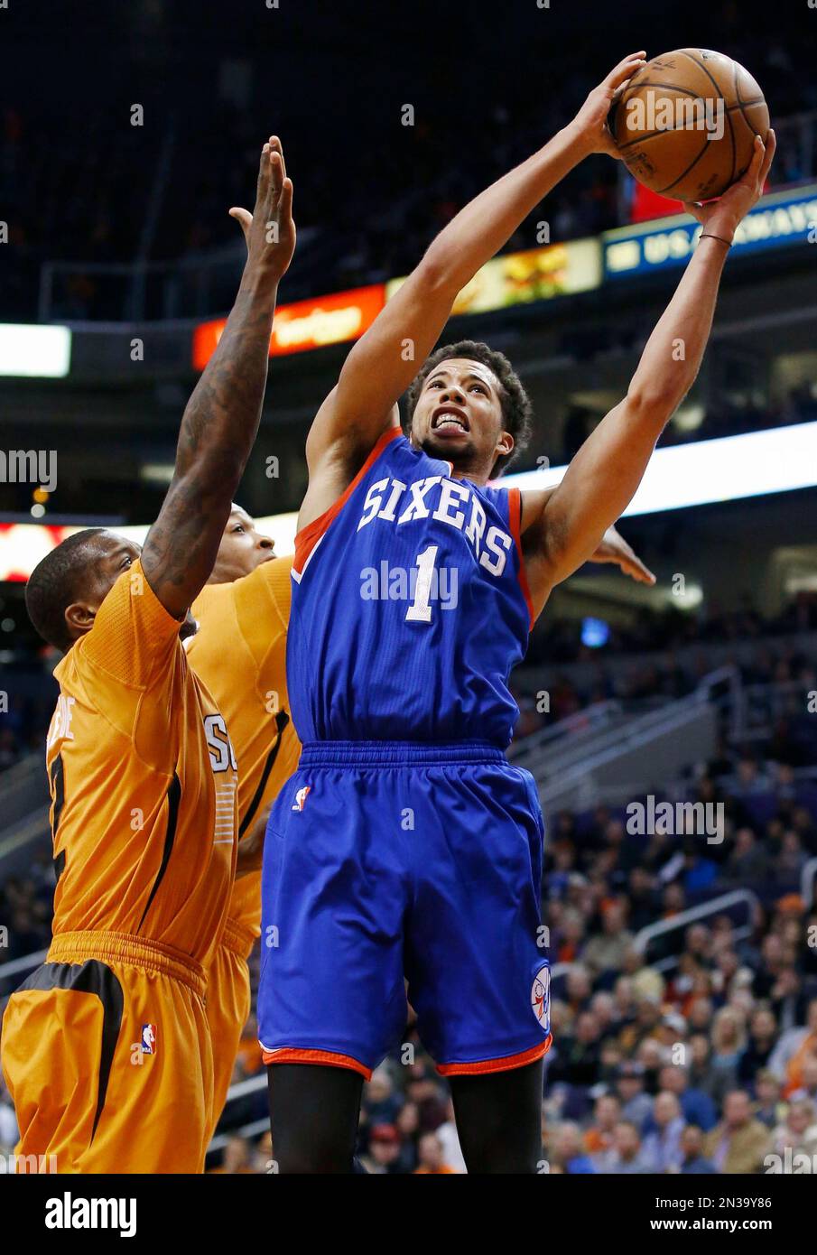Philadelphia 76ers' Michael Carter-Williams (1) gets past Phoenix Suns ...