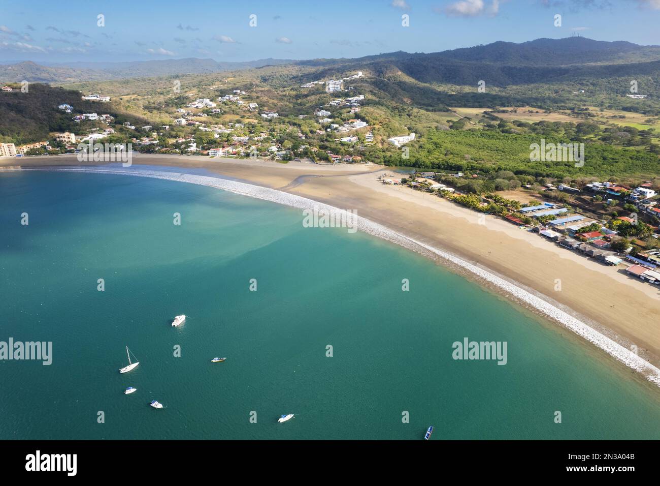 Tropical beach aerial drone view with hotels and restaurant Stock Photo ...