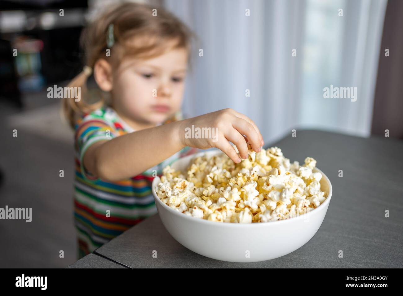 Child preteen eating popcorn hi-res stock photography and images - Alamy
