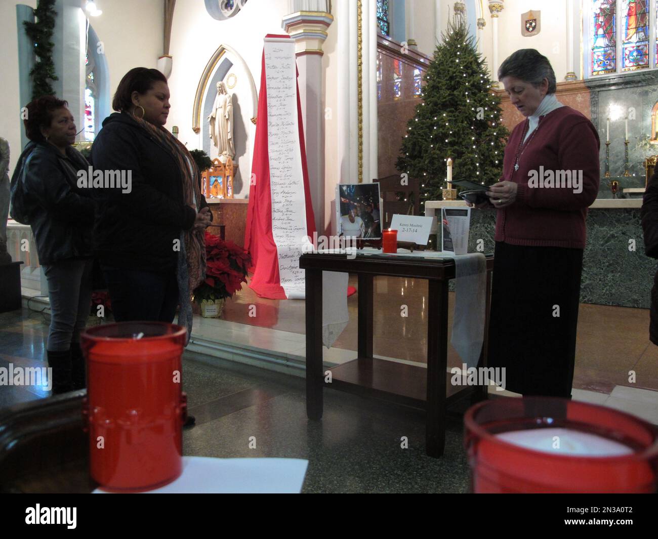 In this Tuesday, Dec. 30, 2014 photo, Carmen Marquez watches as Sister ...