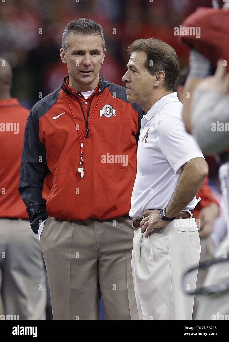 Ohio State head coach Urban Meyer, left, speaks with Alabama head coach ...