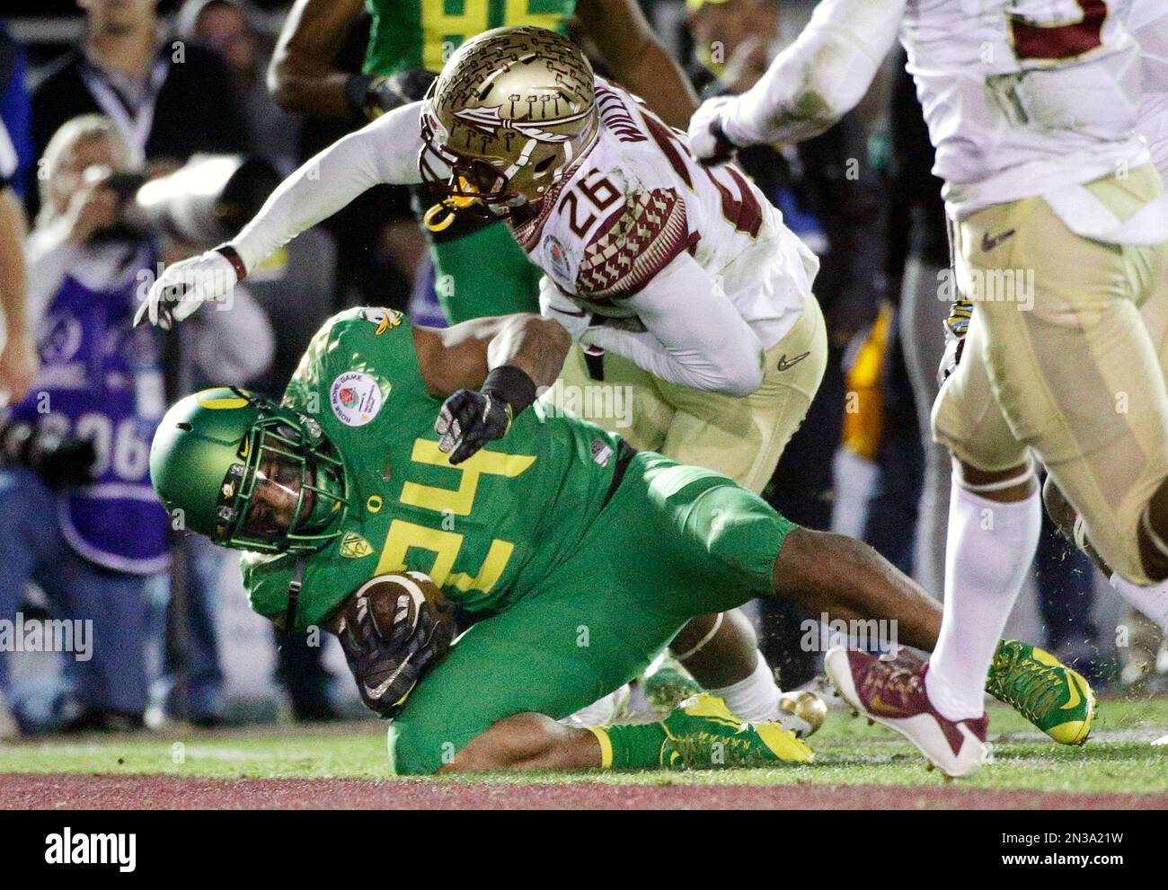 Oregon running back Thomas Tyner, bottom, scores past Florida State ...