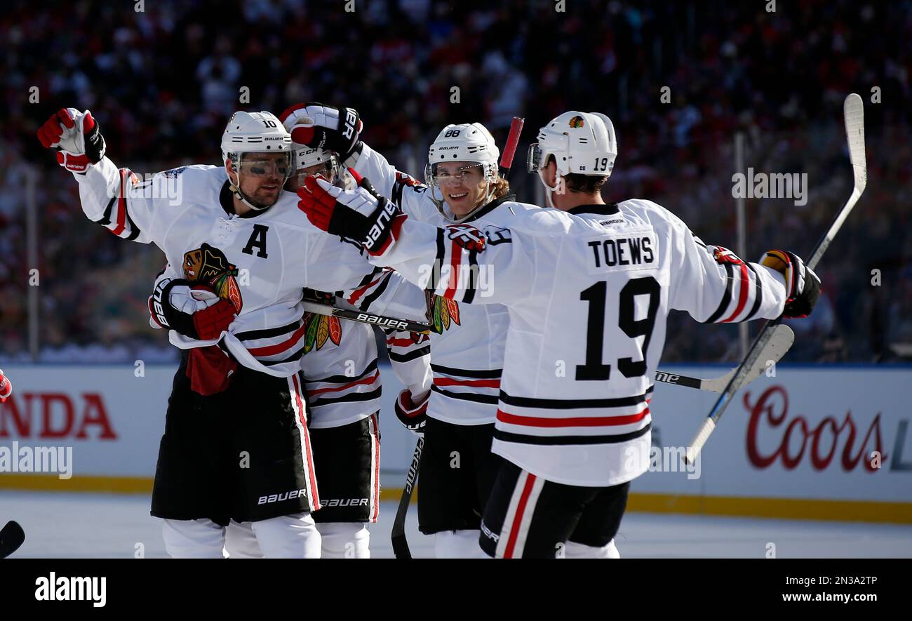 Chicago Blackhawks left wing Patrick Sharp, left, celebrates his goal ...