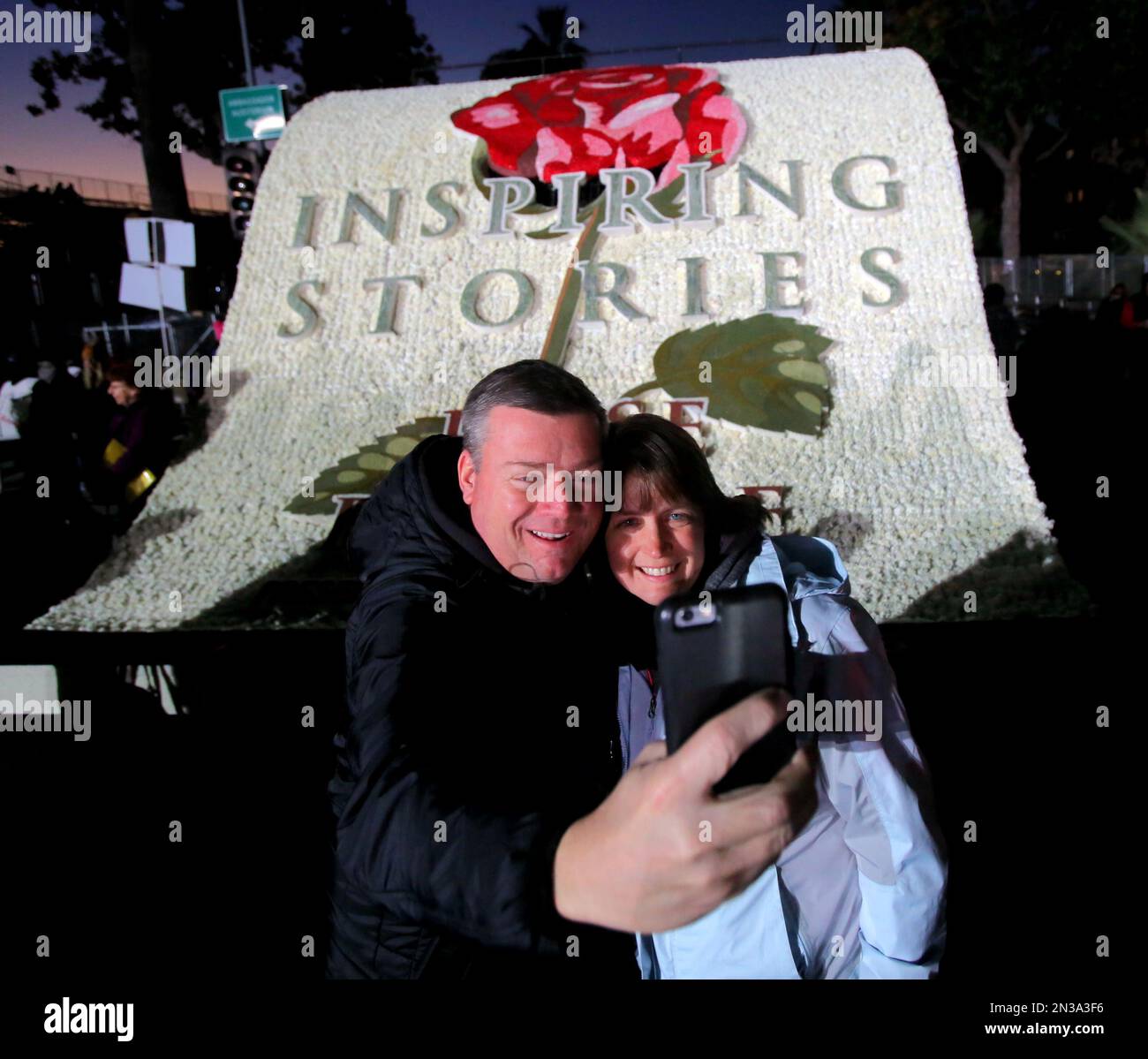 Bill Ziegler of Philadelphia, takes pictures with his wife Kim in front ...