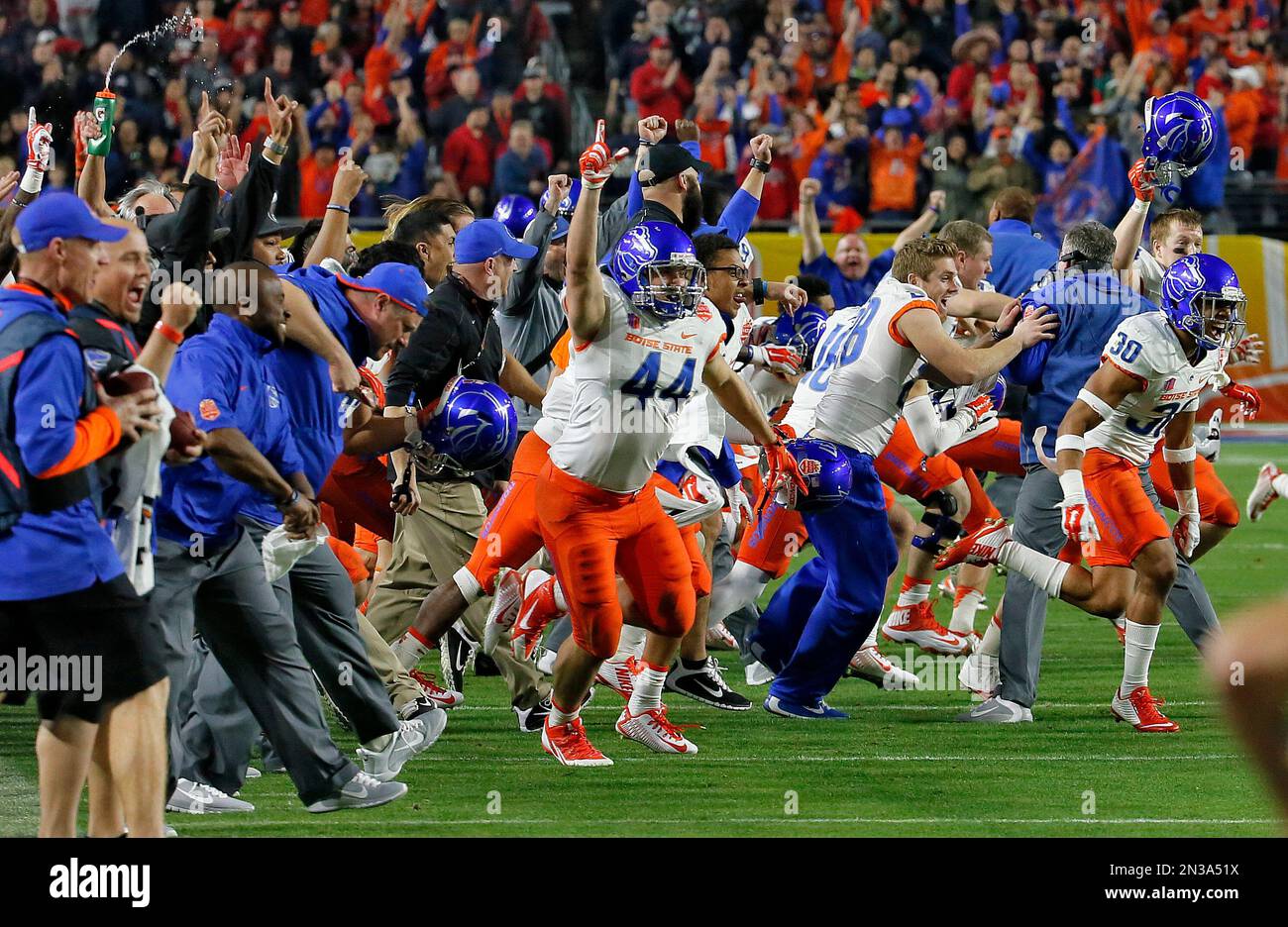 Boise State players run on the field as time expires in the Fiesta Bowl ...