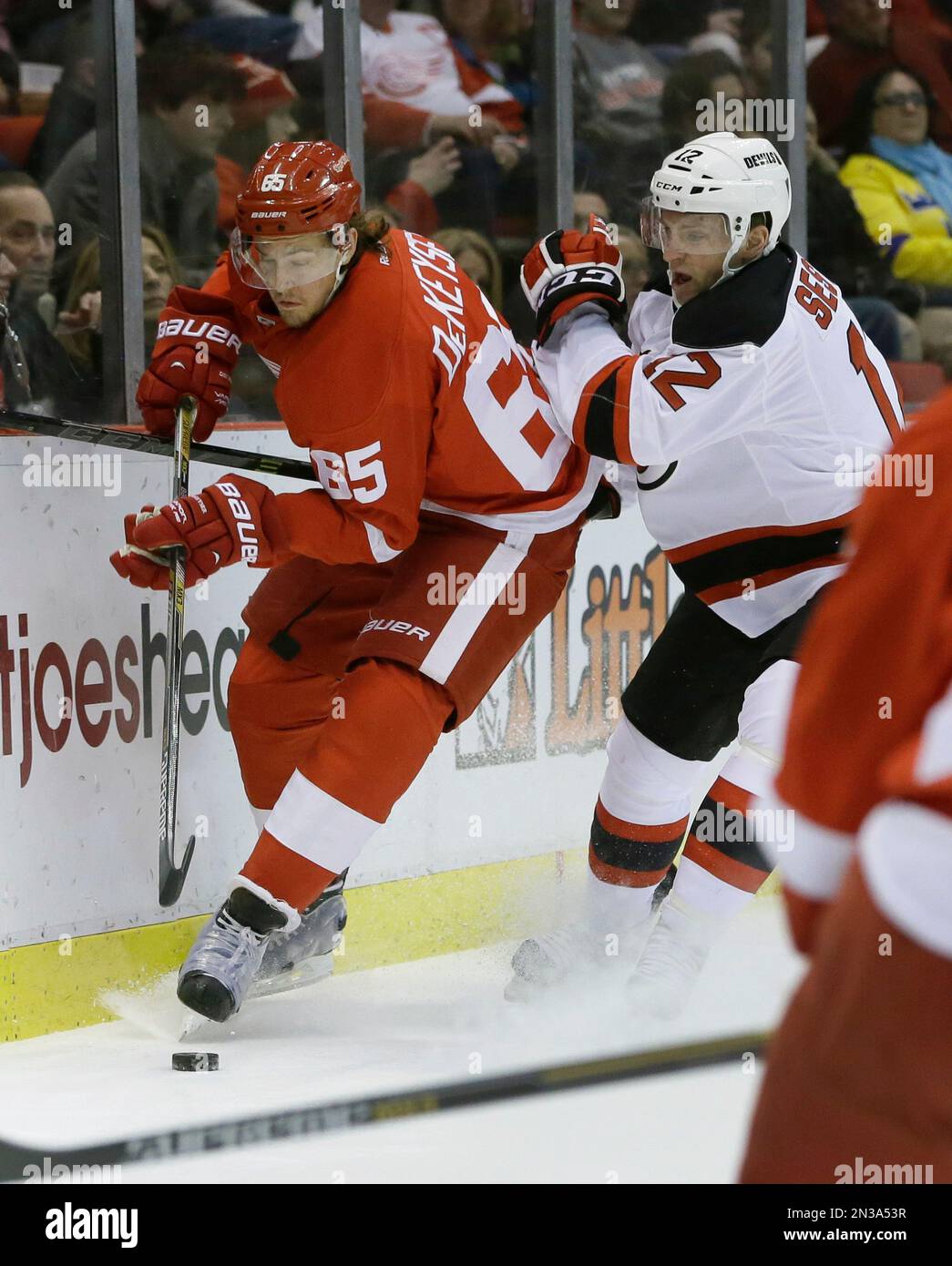 Detroit Red Wings defenseman Danny DeKeyser (65) and New Jersey Devils ...