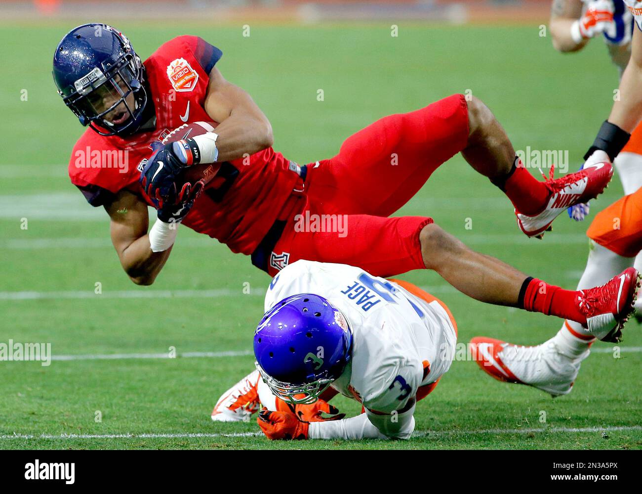 Arizona running back Trey Griffey (5) is hit by Boise State cornerback ...