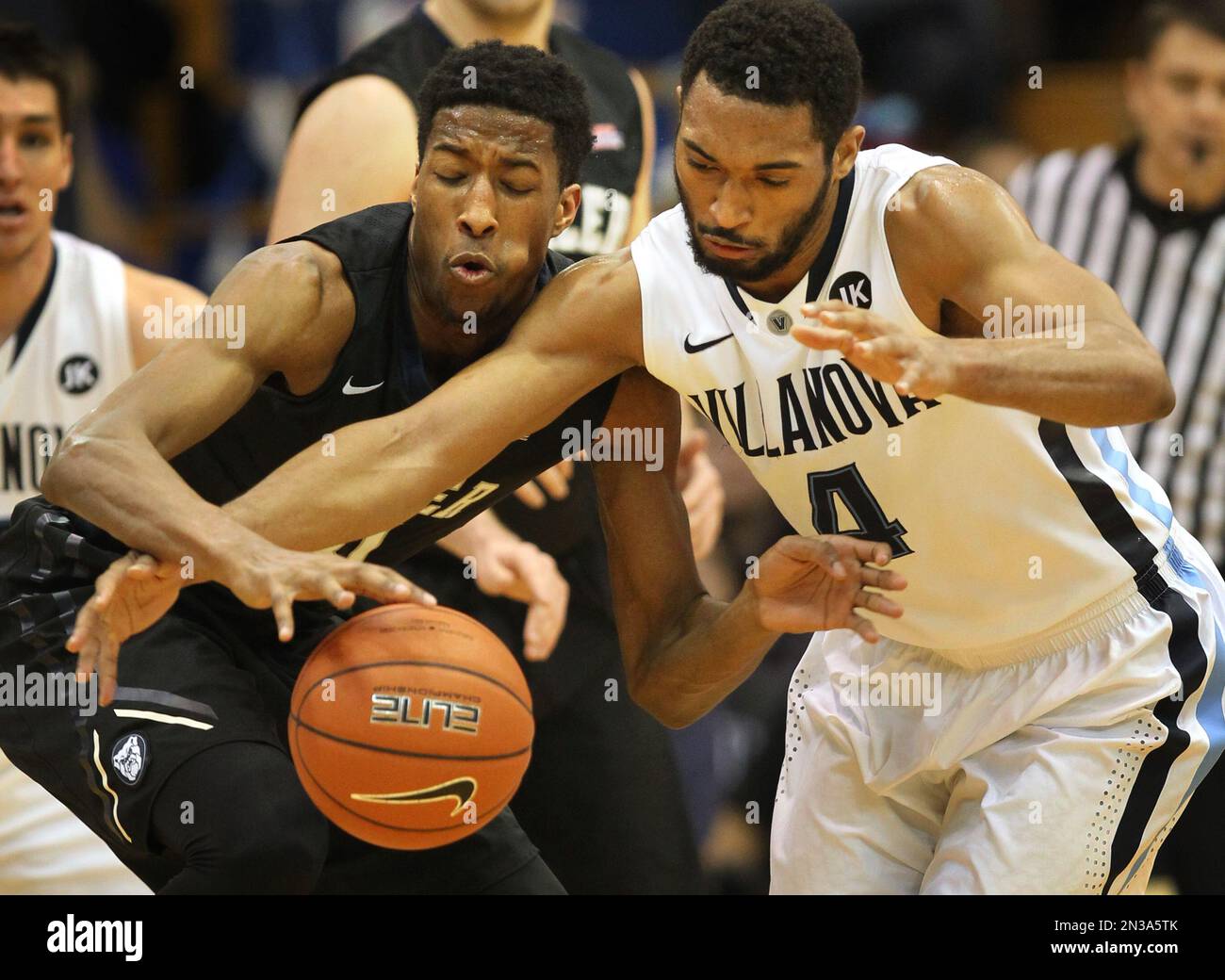 Villanova guard Darrun Hilliard II (4) and Butler forward Kameron Woods ...