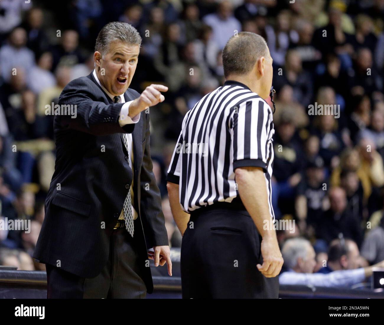 Purdue head coach Matt Painter, left, yells at official Terry Wymer in ...