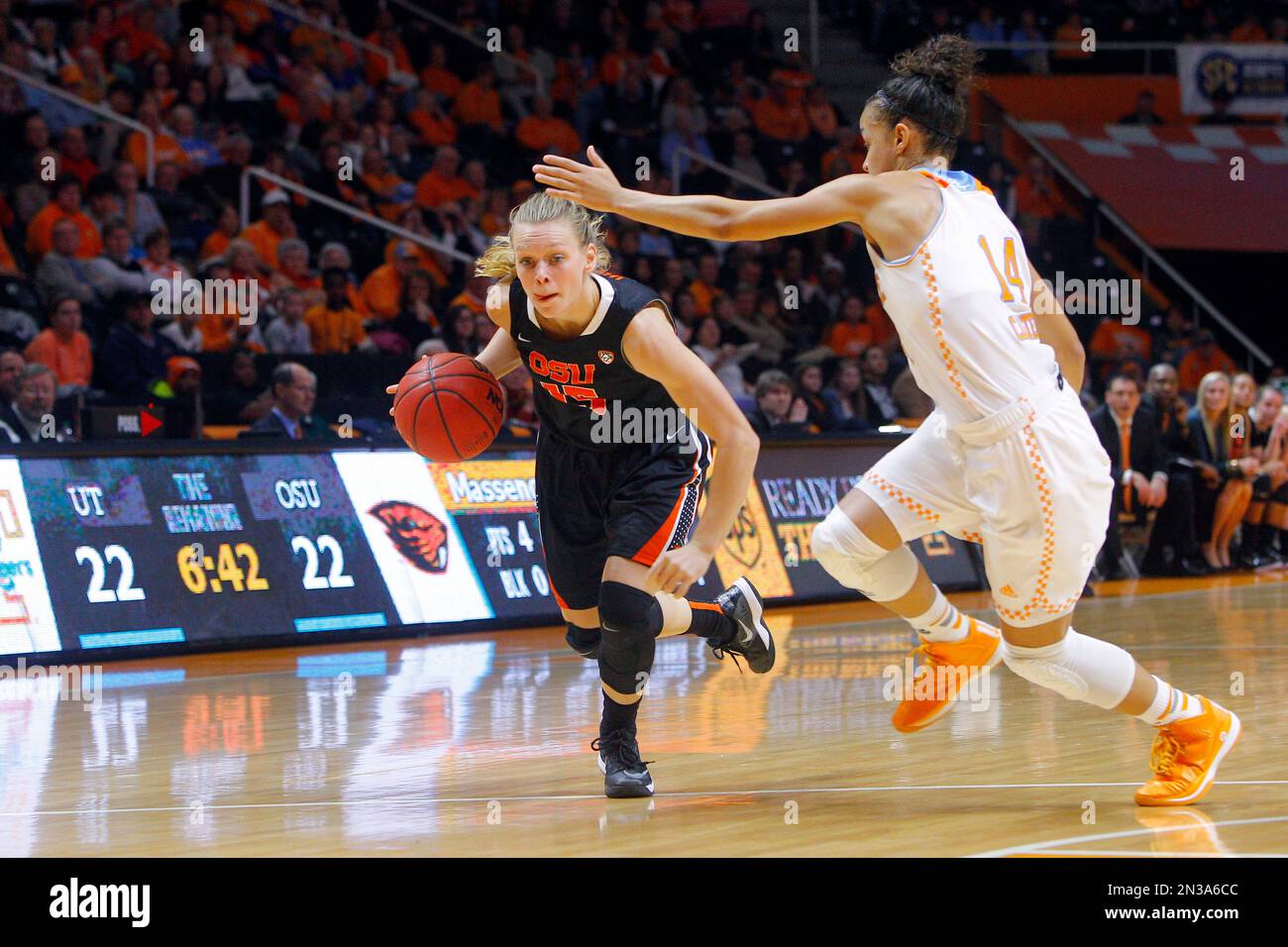 Oregon State guard Jamie Weisner (15) drives as she's defended by ...