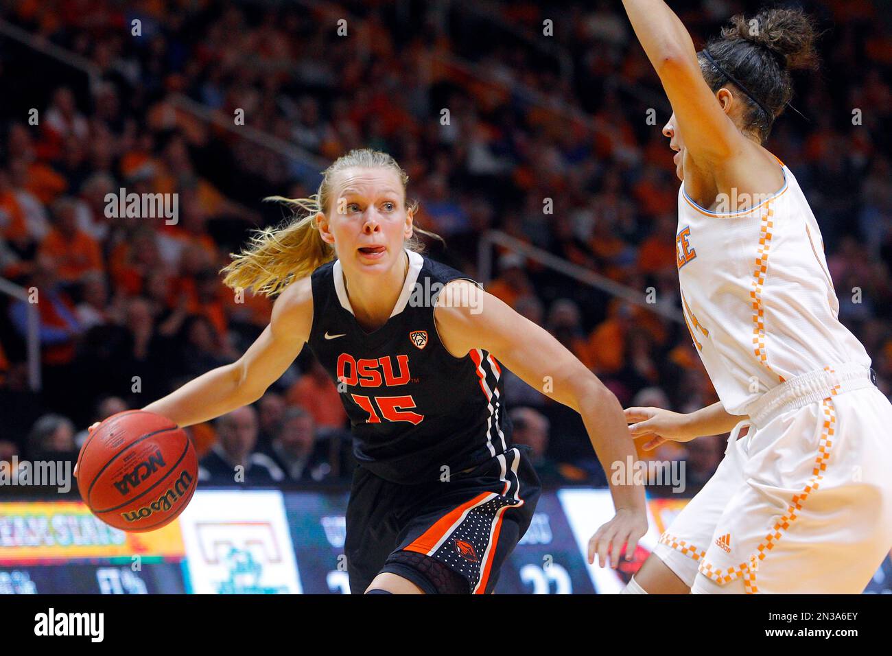 Oregon State guard Jamie Weisner (15) drives as she's defended by ...