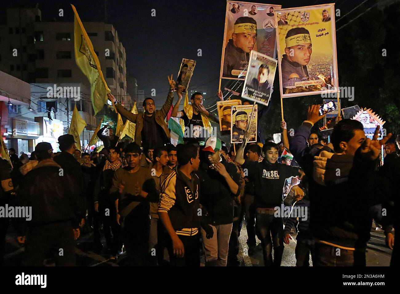 Palestinians wave yellow Fatah flags during celebrations marking the ...