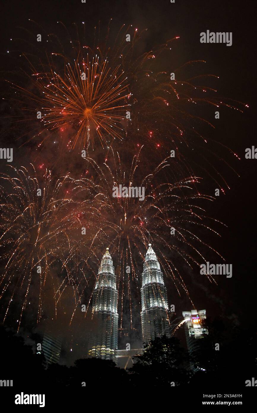 Fireworks explode over Malaysia's landmark Petronas Twin Towers during ...