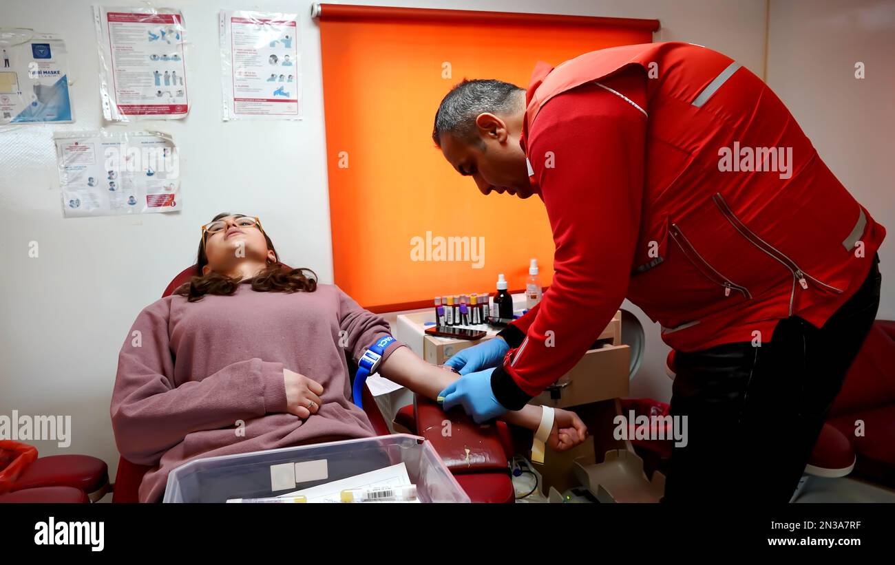 Teenager giving blood hi-res stock photography and images - Alamy
