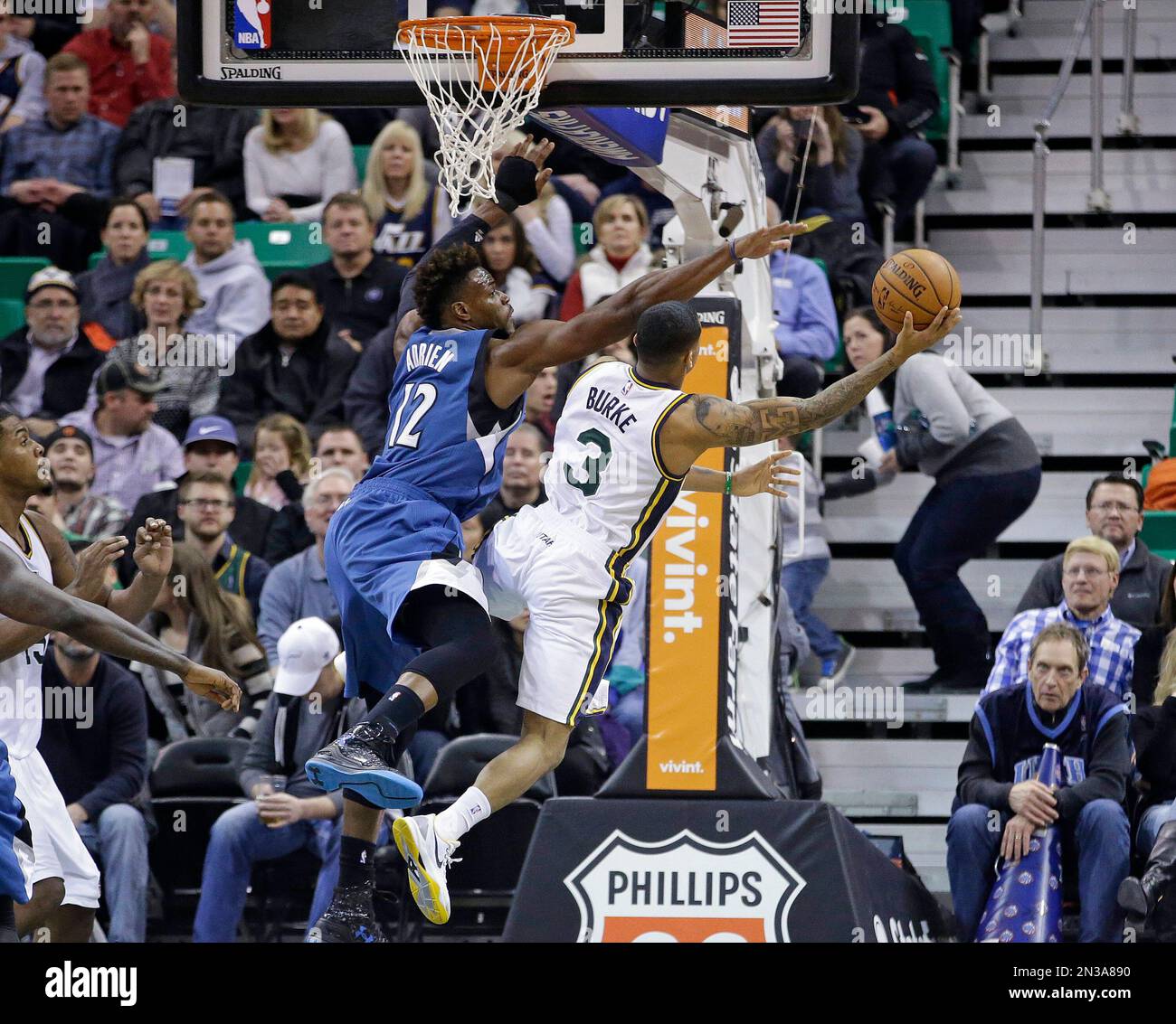 Utah Jazz guard Trey Burke (3) shoots as Minnesota Timberwolves forward ...