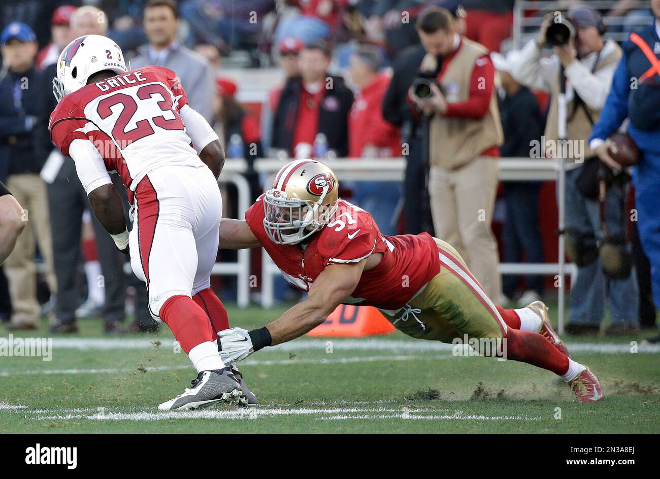 San Francisco 49ers linebacker Michael Wilhoite (57) tackles Arizona ...