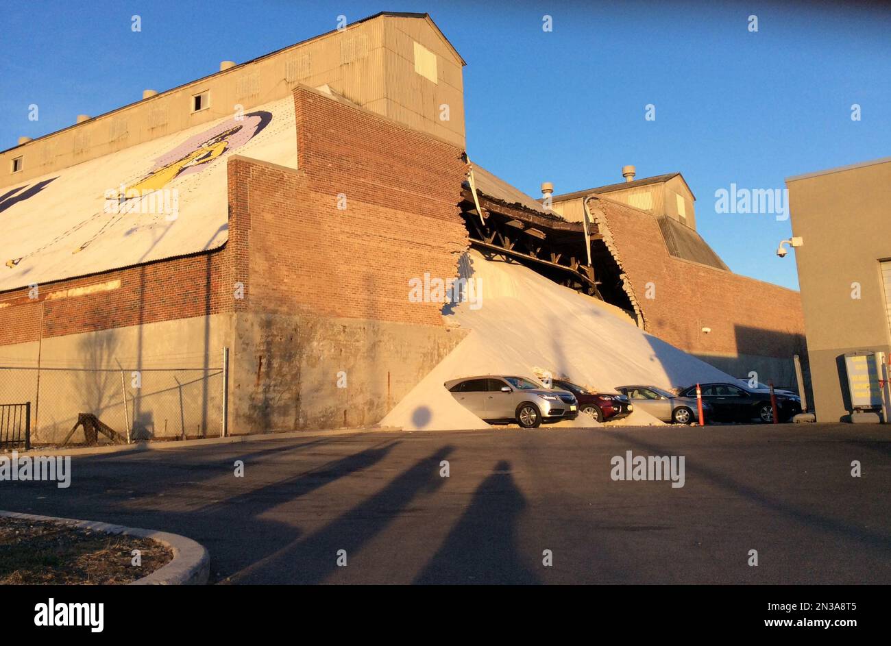 Spilled road salt covers several cars on Tuesday, Dec. 30, 2014, in ...