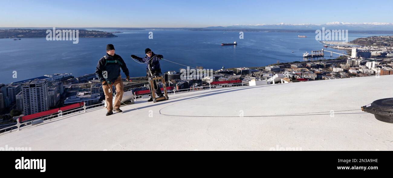 Scott Streeper, left, and Brian Morningstar, of Pyro Spectaculars, walk ...