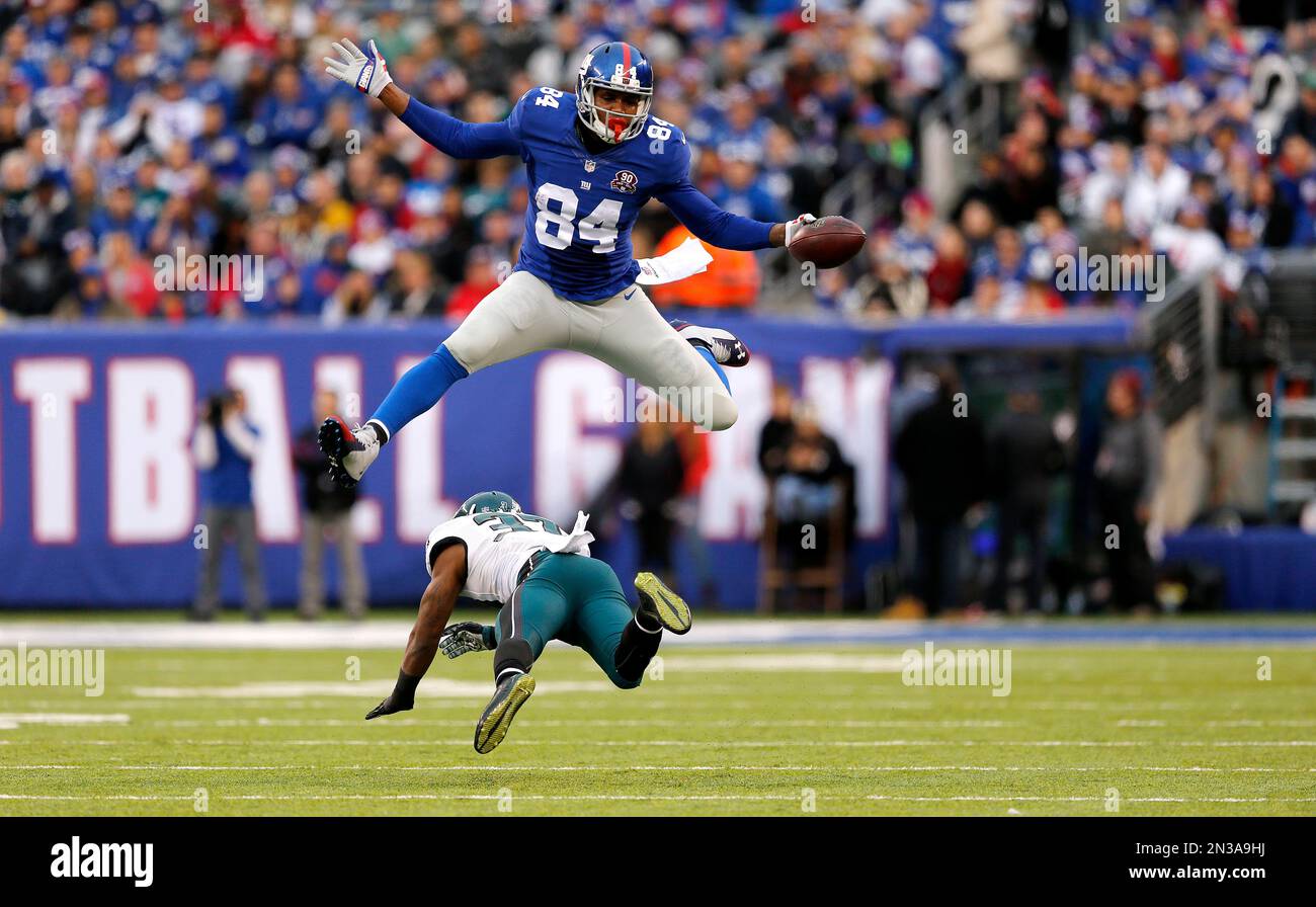 New York Giants' Larry Donnell (84) hurdles Philadelphia Eagles' Jaylen ...