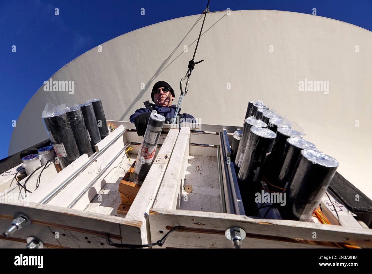 Brian Morningstar, of Pyro Spectaculars, pulls a crate of wired ...