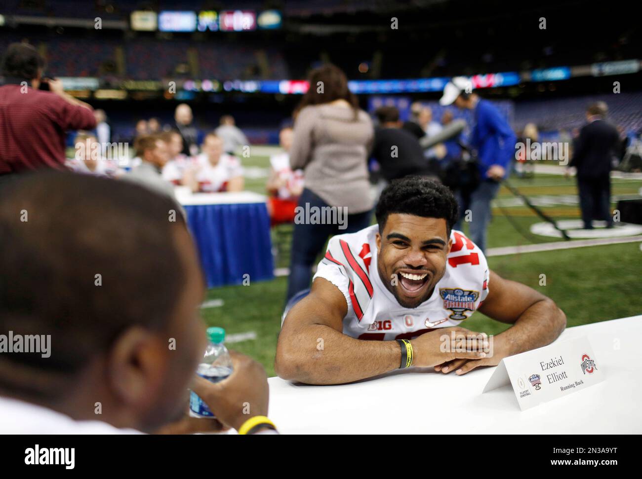 Ohio State running back Ezekiel Elliott, right, laughs with quarterback ...