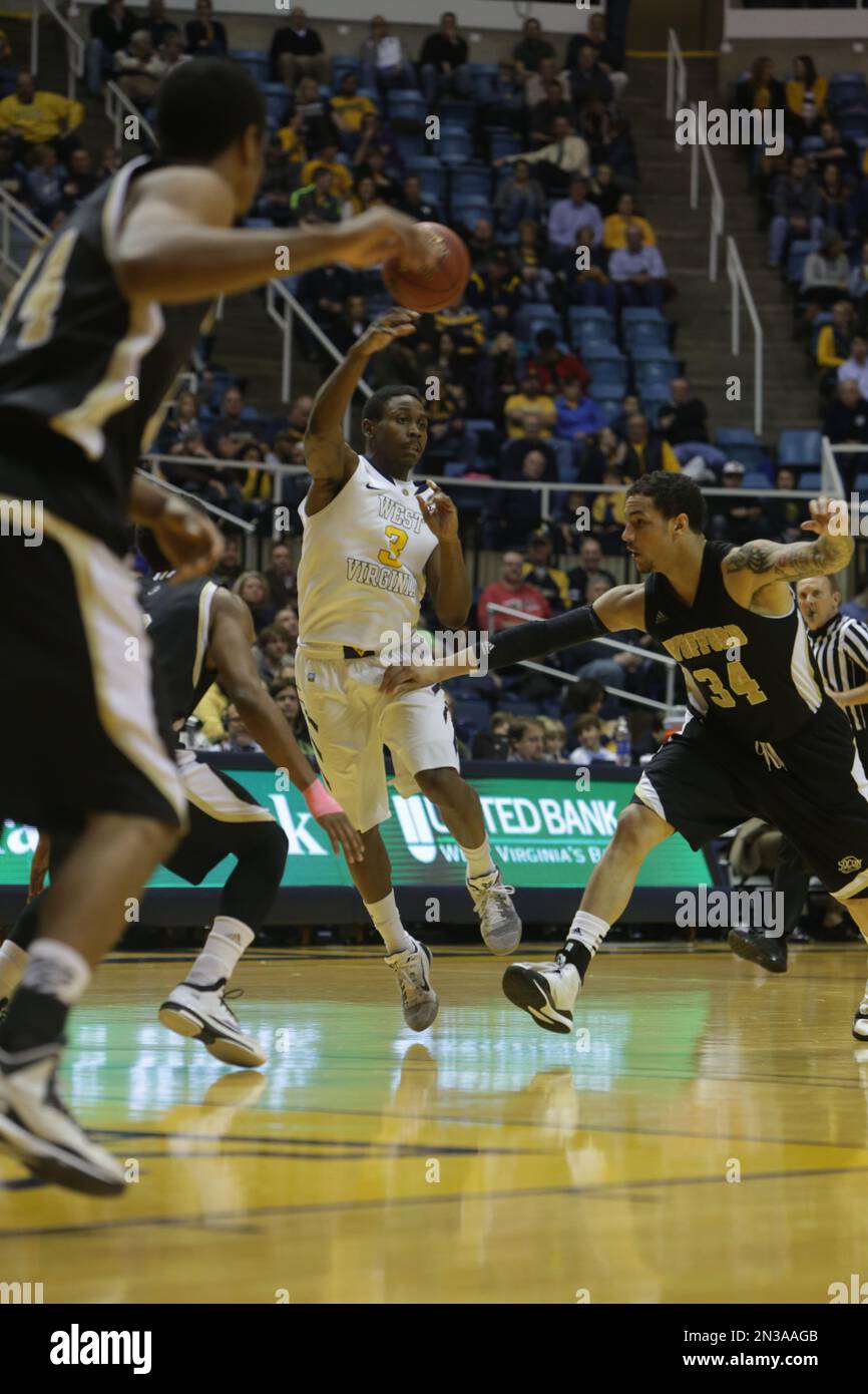 West Virginia guard Juwan Staten (3) drives past Wofford forward Lee ...