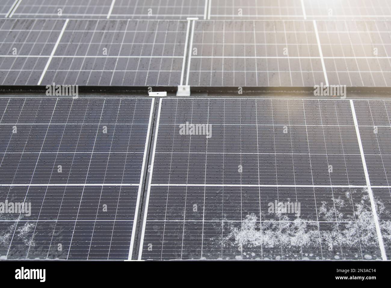 Solar panel in winter. Solar panels are covered with snow on the roof ...