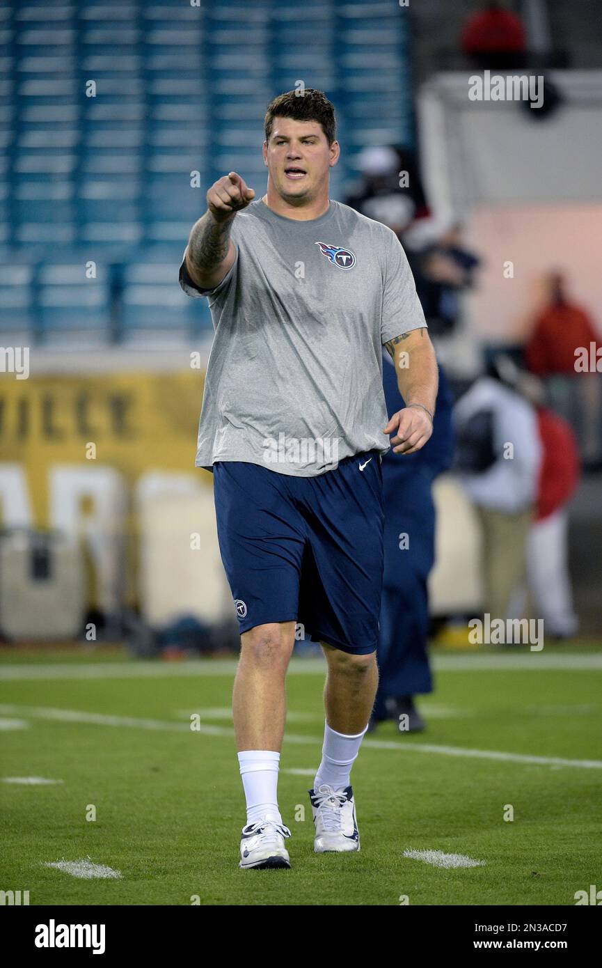 Tennessee Titans tackle Taylor Lewan walks on the field before an NFL ...