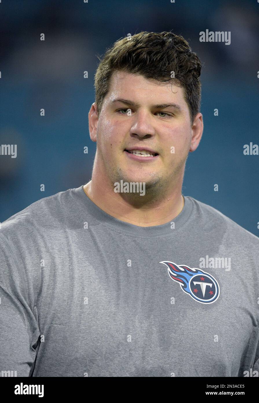 Tennessee Titans tackle Taylor Lewan walks on the field before an NFL ...