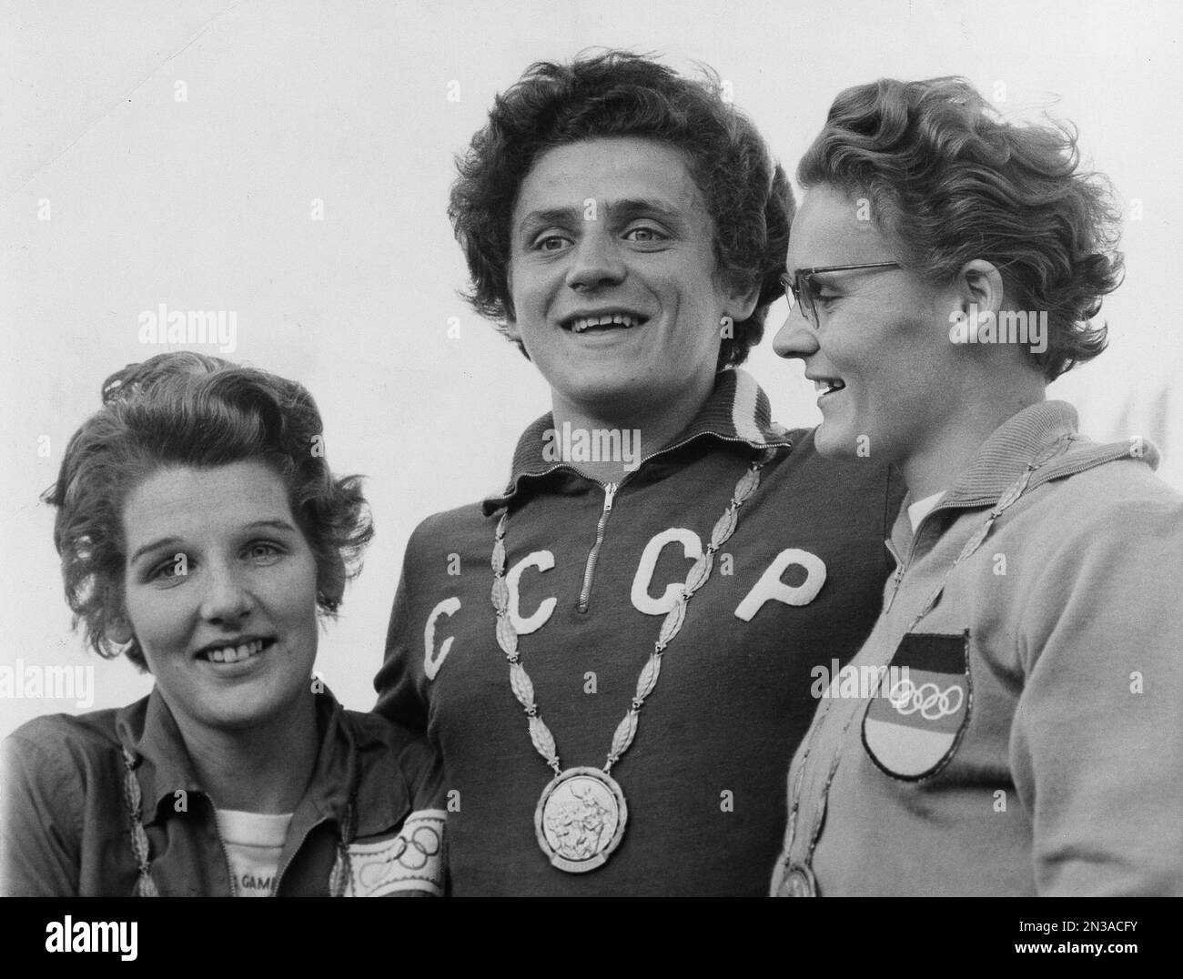 Irina Press, center, of Russia, winner of the Olympic gold medal for ...