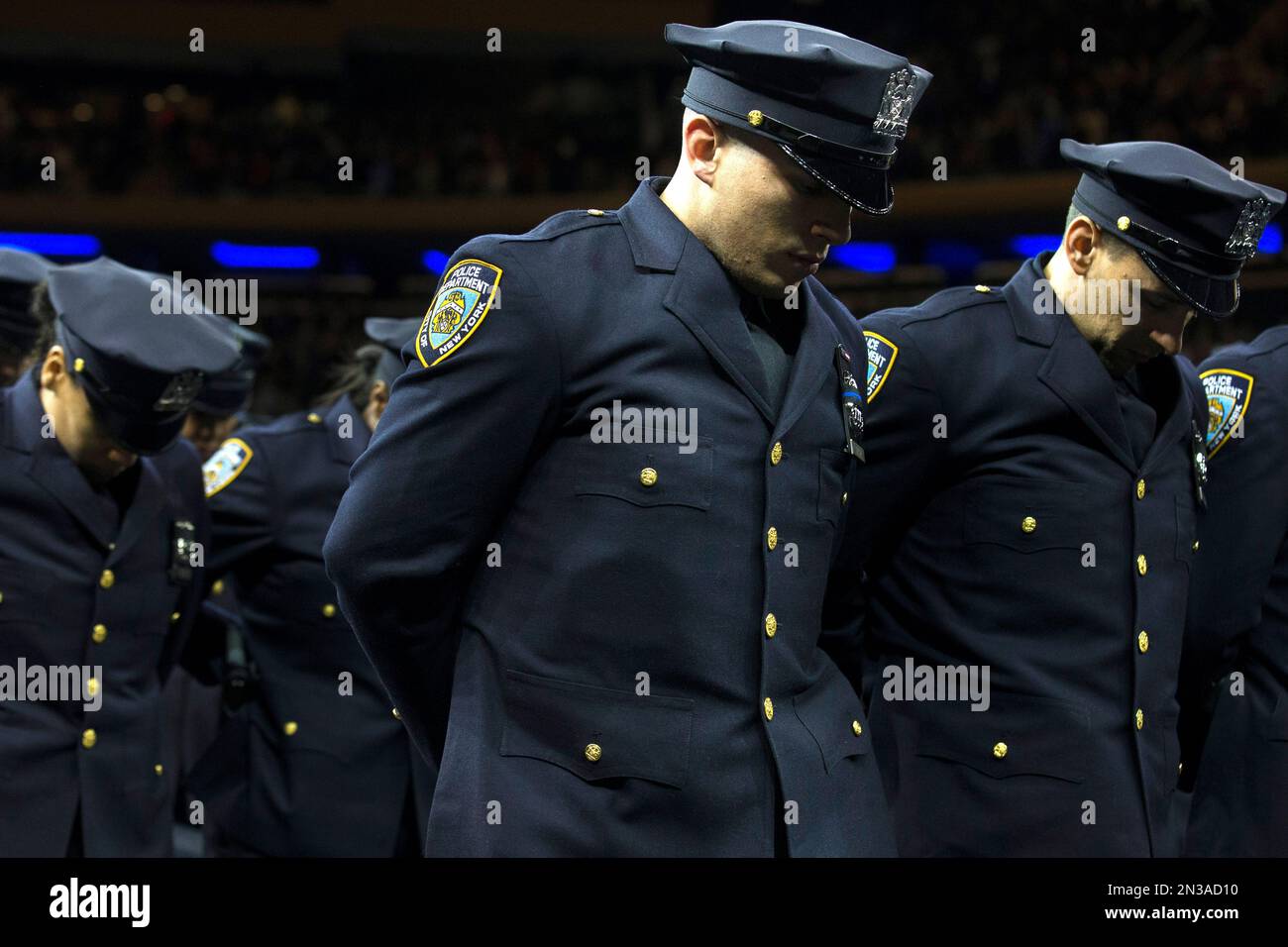 New recruits bow their heads for a moment of silence for deceased ...