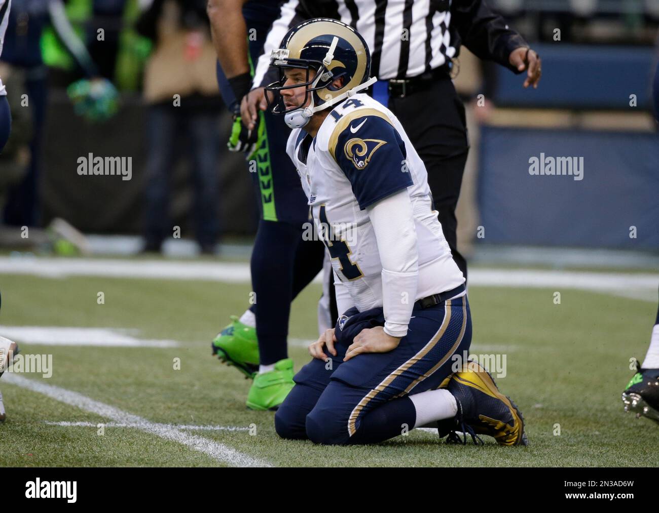 St. Louis Rams quarterback Shaun Hill kneels on the tuft in the second ...