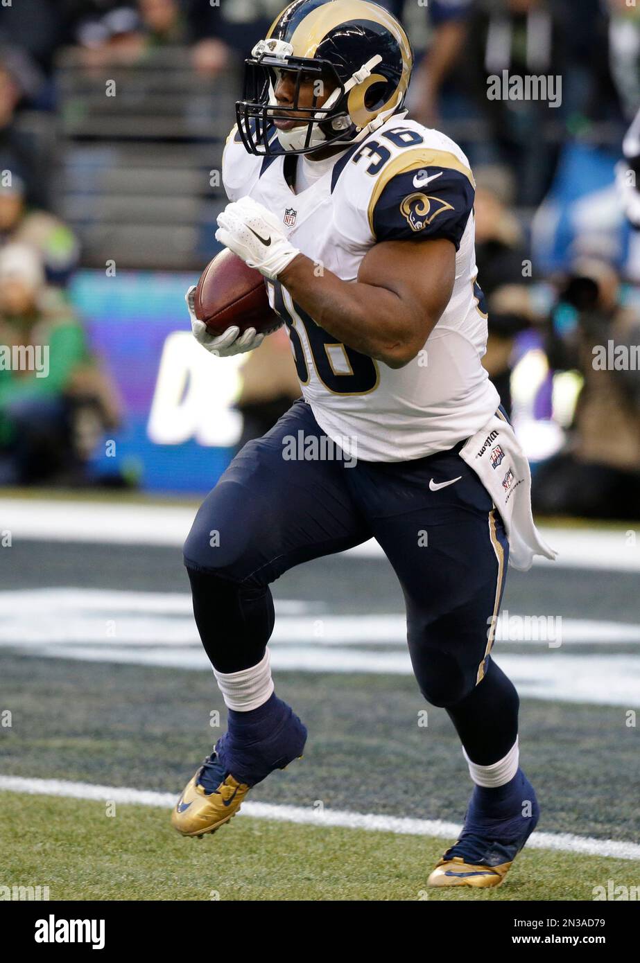 St. Louis Rams running back Benjamin Cunningham carries the ball ...