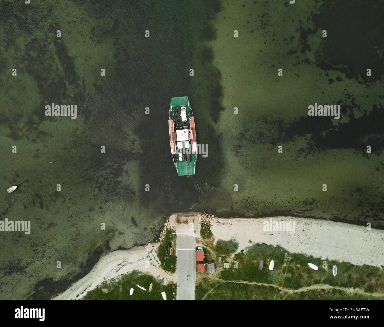 An aerial top view of a Roll-on and roll-off (RORO) ship carrying ...