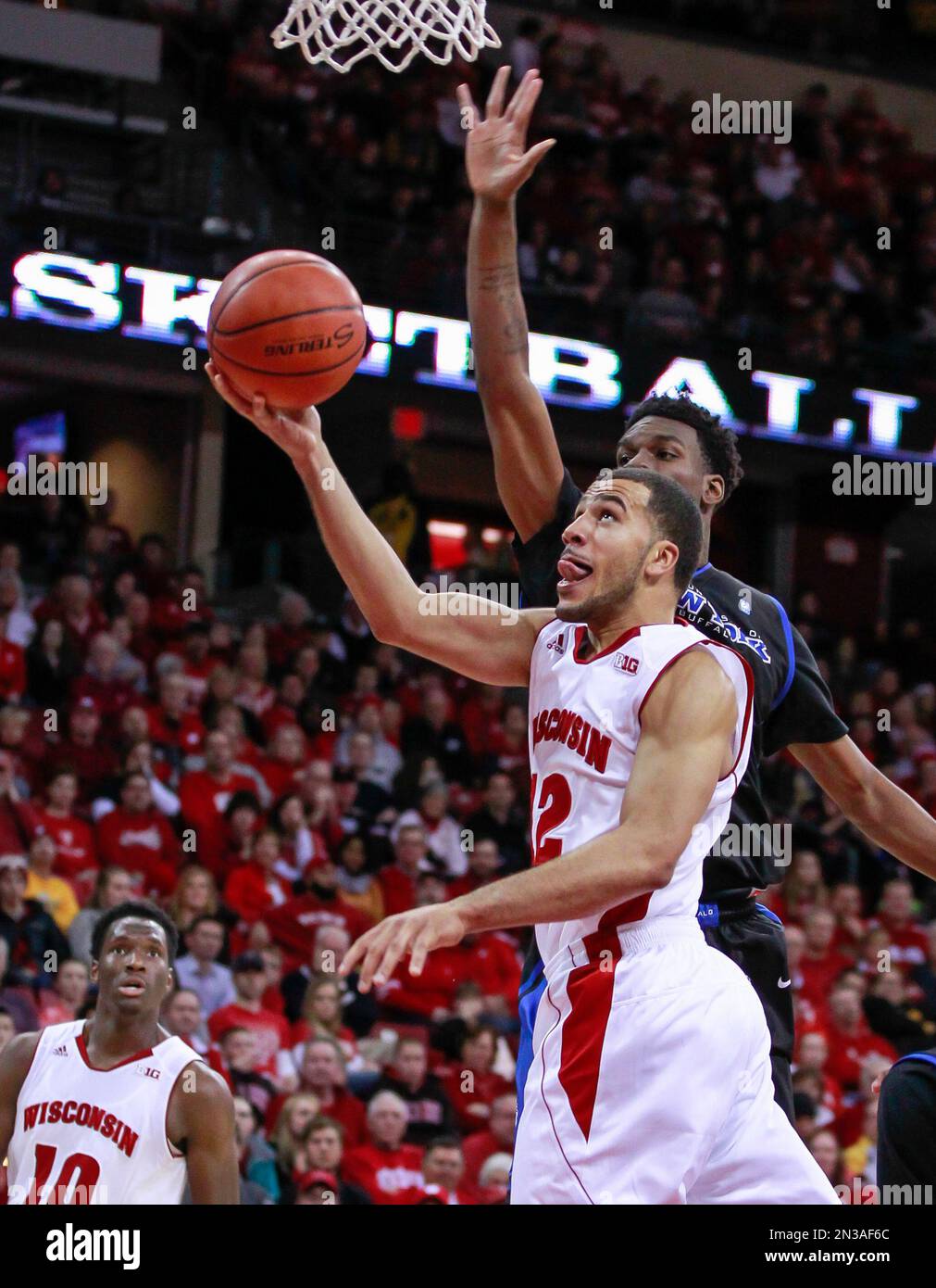 Wisconsin's Traevon Jackson shoots against Shannon Evans during the ...