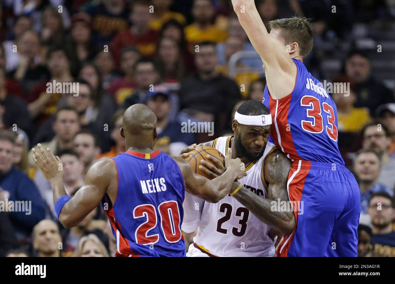 Cleveland Cavaliers' LeBron James (23) tries to squeeze between Detroit ...