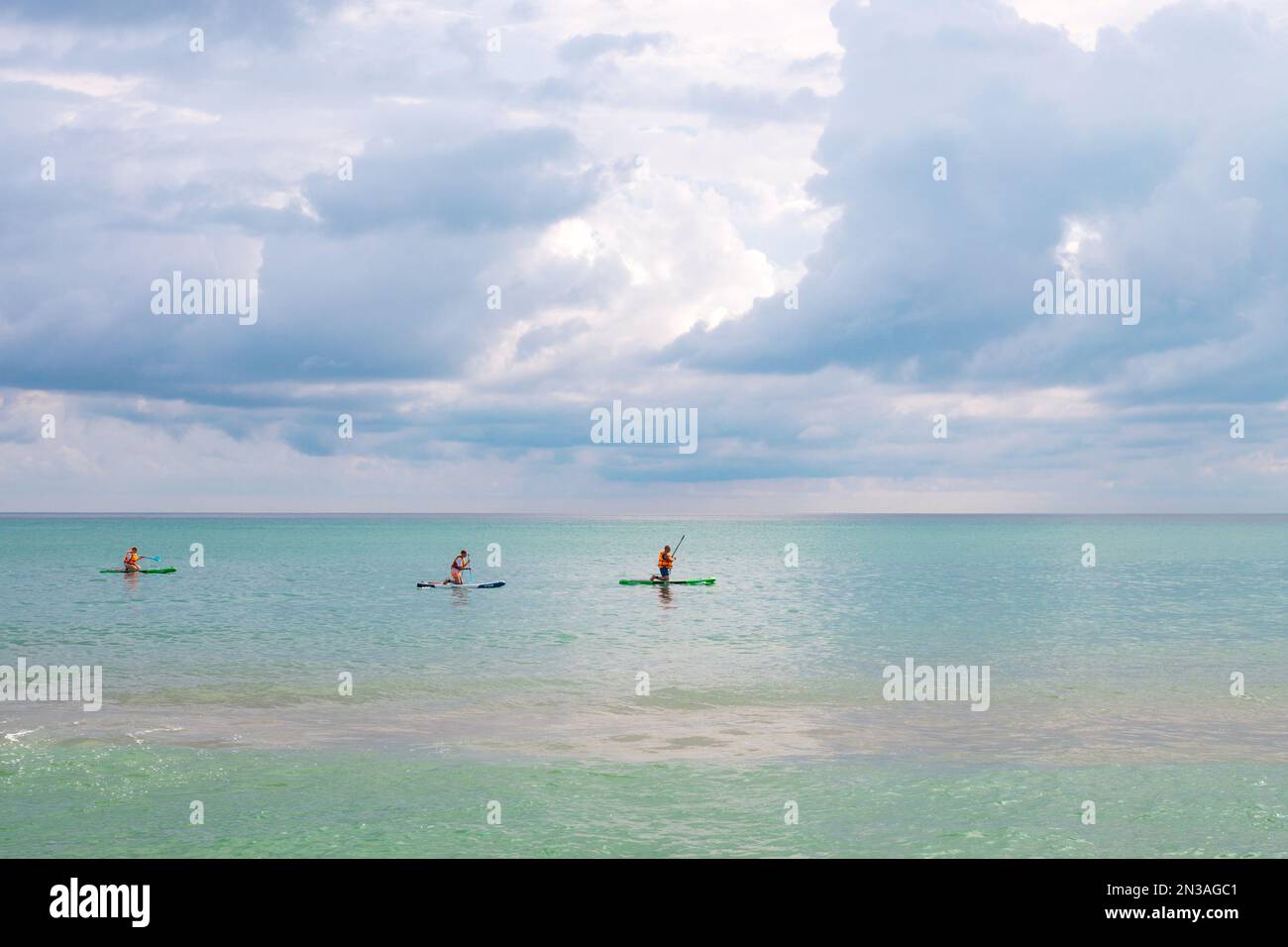 Vacation activities and leisure time. Vacationers at sea sailing on sap ...