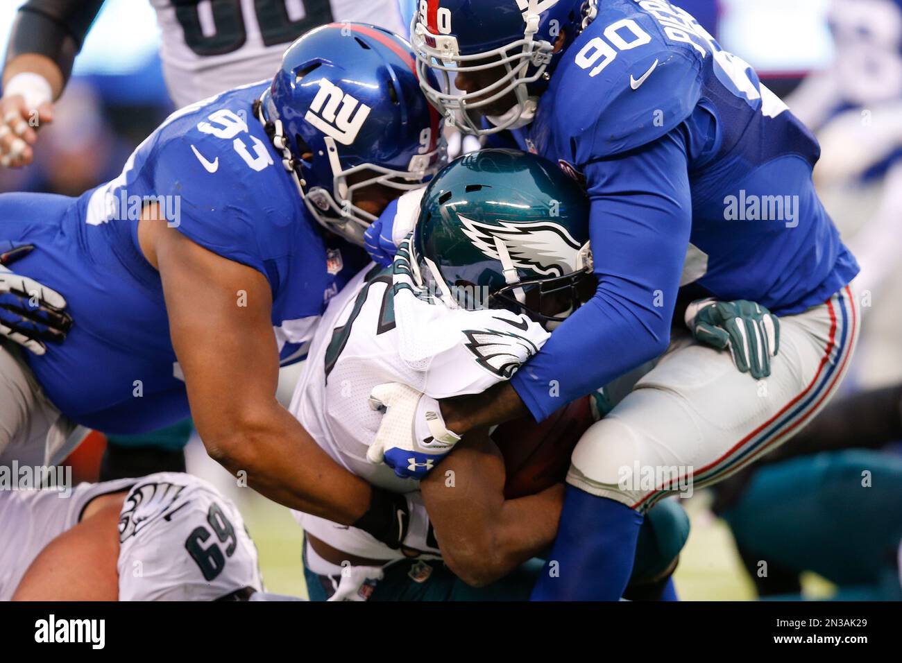 New York Giants' Mike Patterson (93) and Jason Pierre-Paul (90) tackle ...