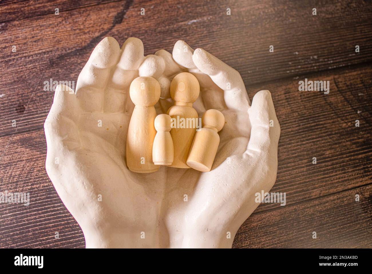 The young man used both of his hands to protect from the falling wooden ...