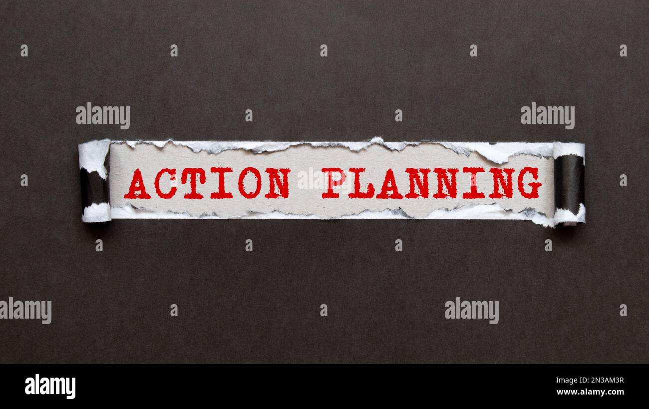 Action plan text on paper in open diary with spectacles, colourful push ...