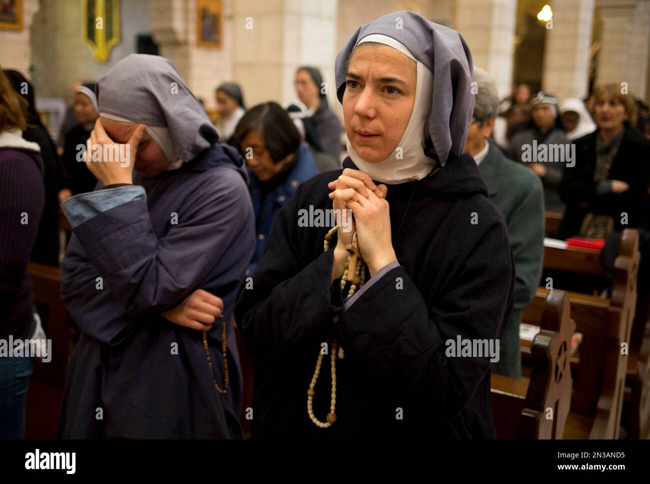 Nuns pray during the last Sunday Mass before Christmas in the Church of ...