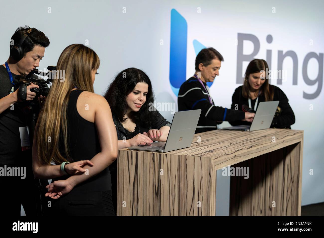 Microsoft employees including, Dena Saunders, center, demonstrate the ...