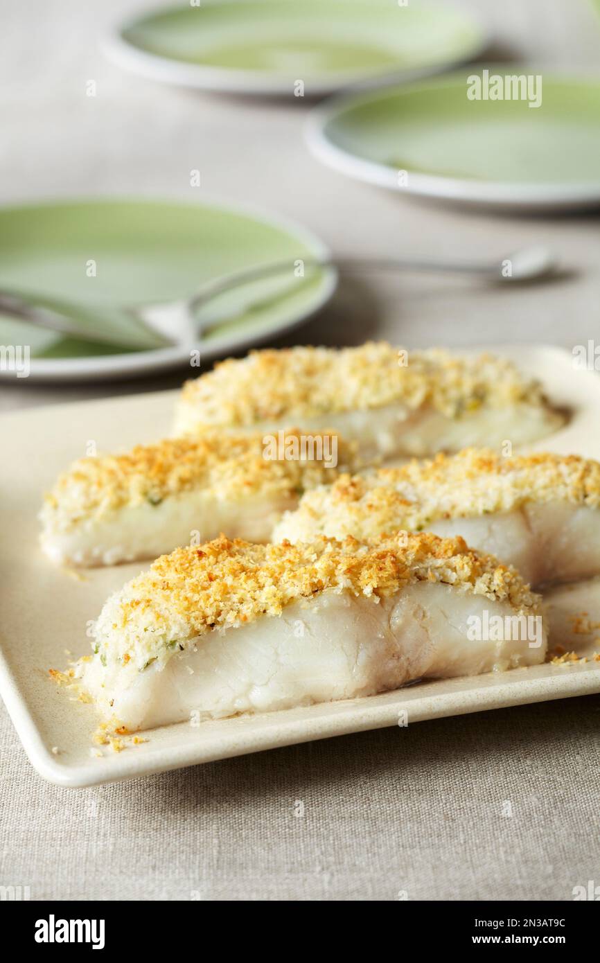 Panko crusted white fish pieces on a serving platter Stock Photo - Alamy