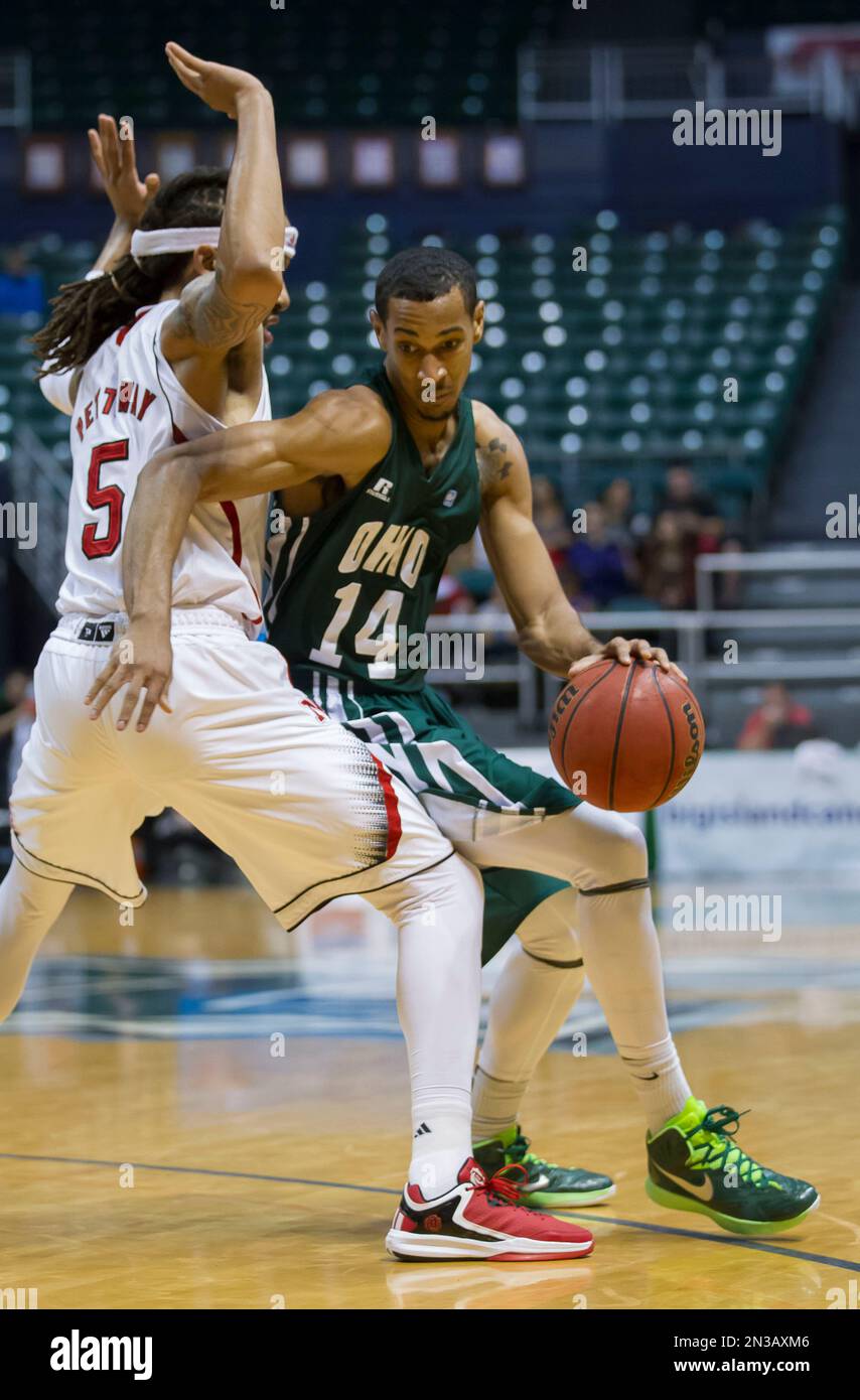 Ohio University guard Ryan Taylor (14) attempts to get around Nebraska ...